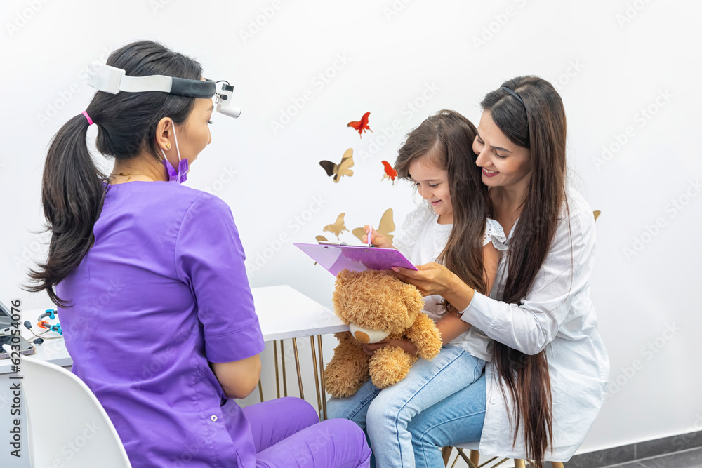 Mom and her infant daughter at the doctor's appointment. Healthy ...