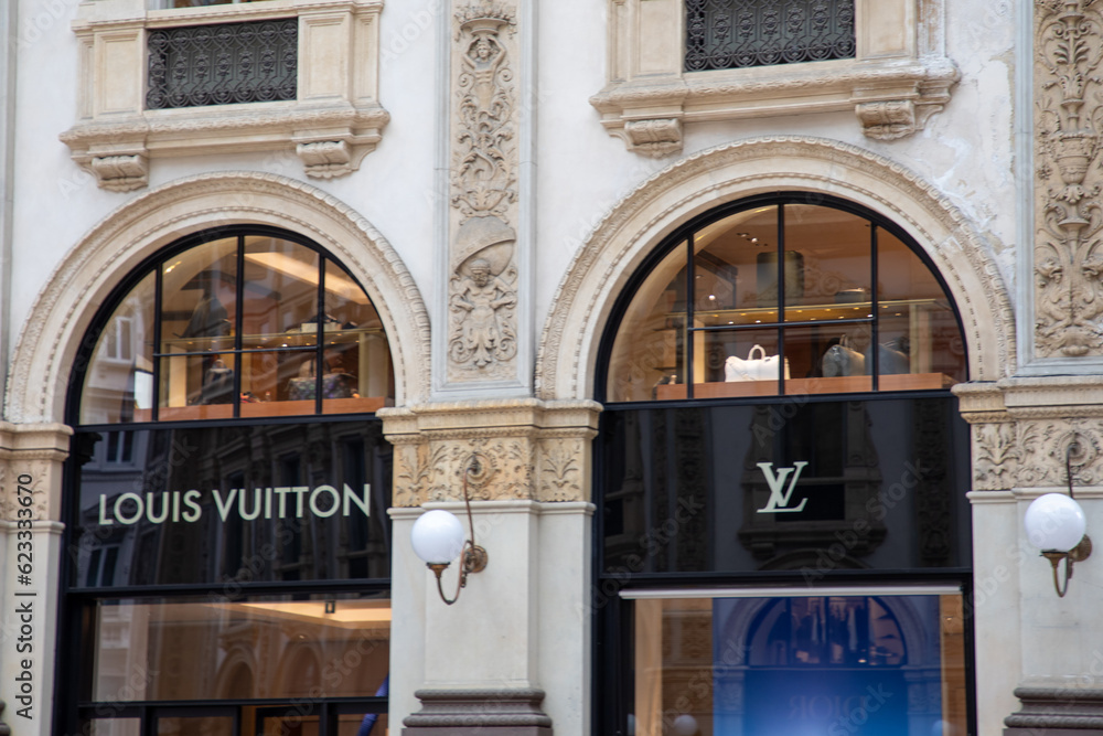 Louis Vuitton logo brand and text sign front entrance facade home shop ...