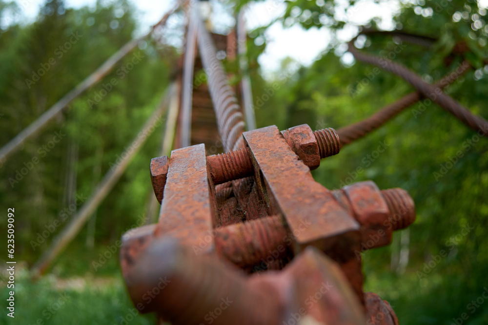 Old Rusty Metal Bolt, suspension bridge in the Oleniye Ruchiye Nature ...
