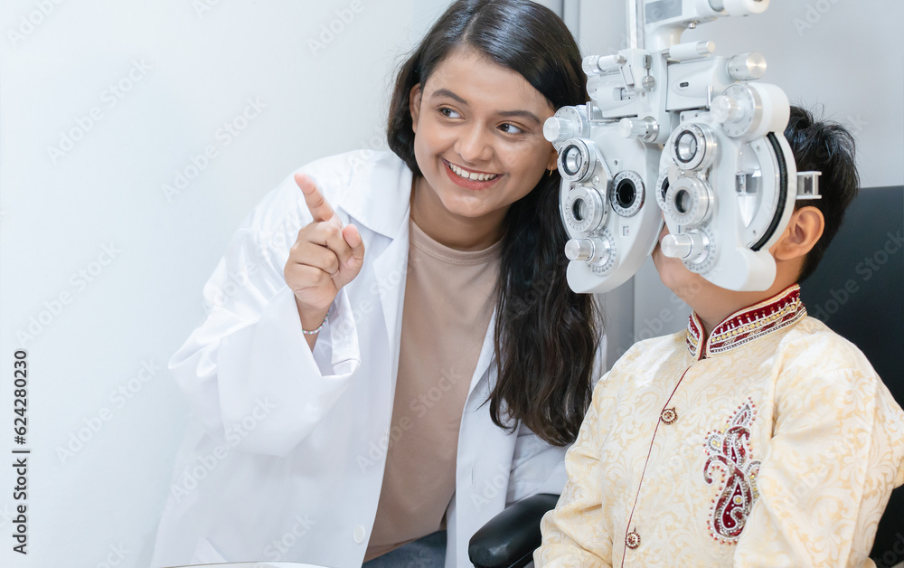 Indian child boy doing subjective refraction with diagnostic ...