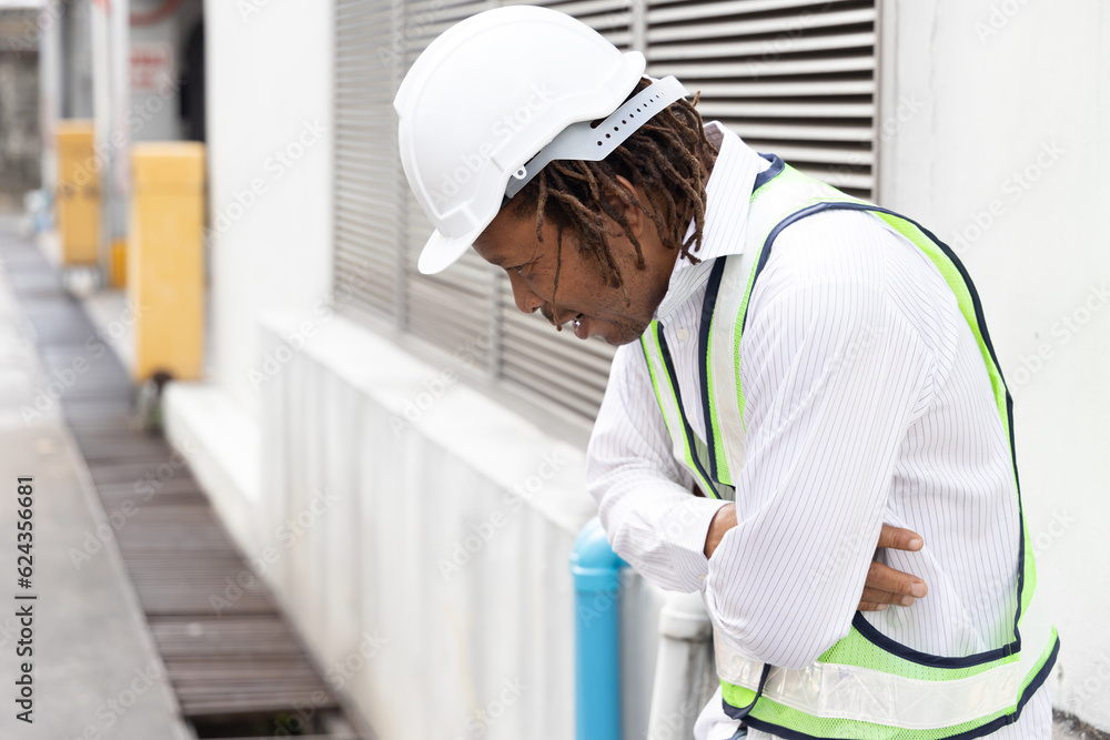 Overworked Male African engineer worker having nausea, stomachache ...