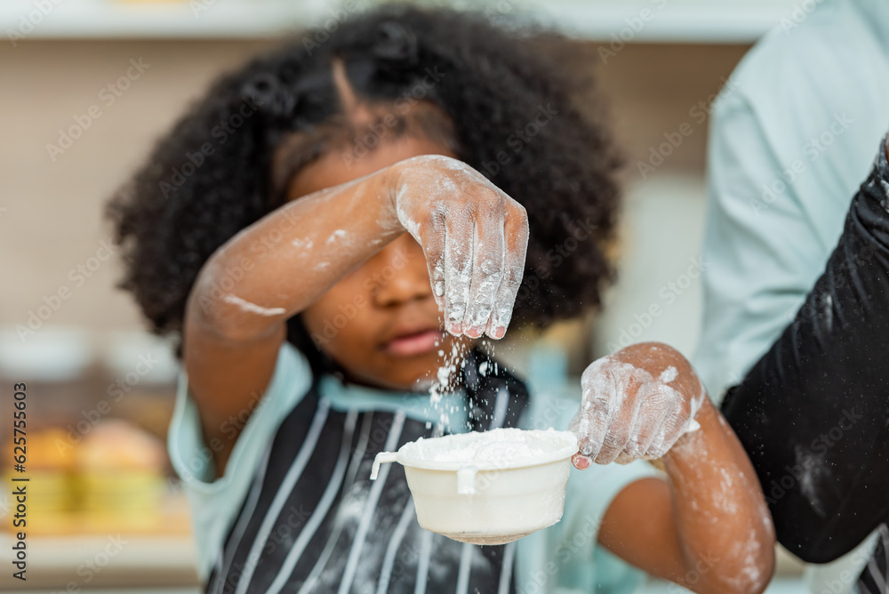 african afro black daughter kids sifting flour powder and sprinkling ...
