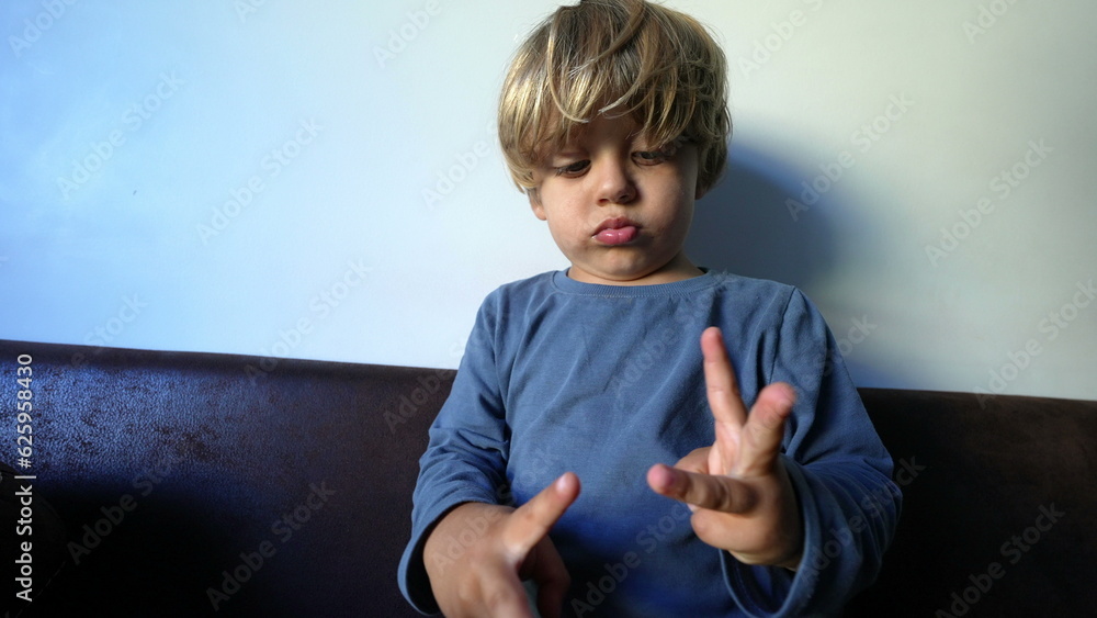 Little boy learning to count with fingers child development Stock Photo ...