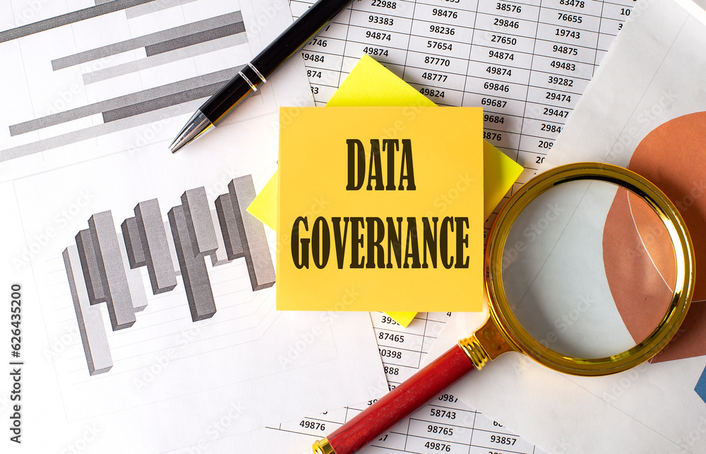 Photo Stock DATA GOVERNANCE text on a sticky on the graph background ...