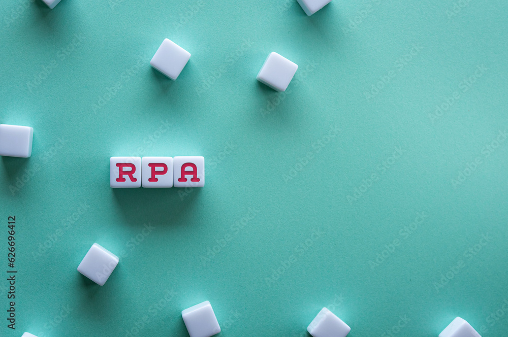 There is white cube with the word RPA. It is an abbreviation for Robotic Process Automation as ...