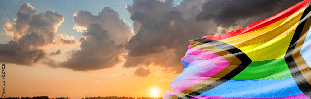 Bi Inclusive Unity flag waving in the wind at cloudy sky. Freedom and ...