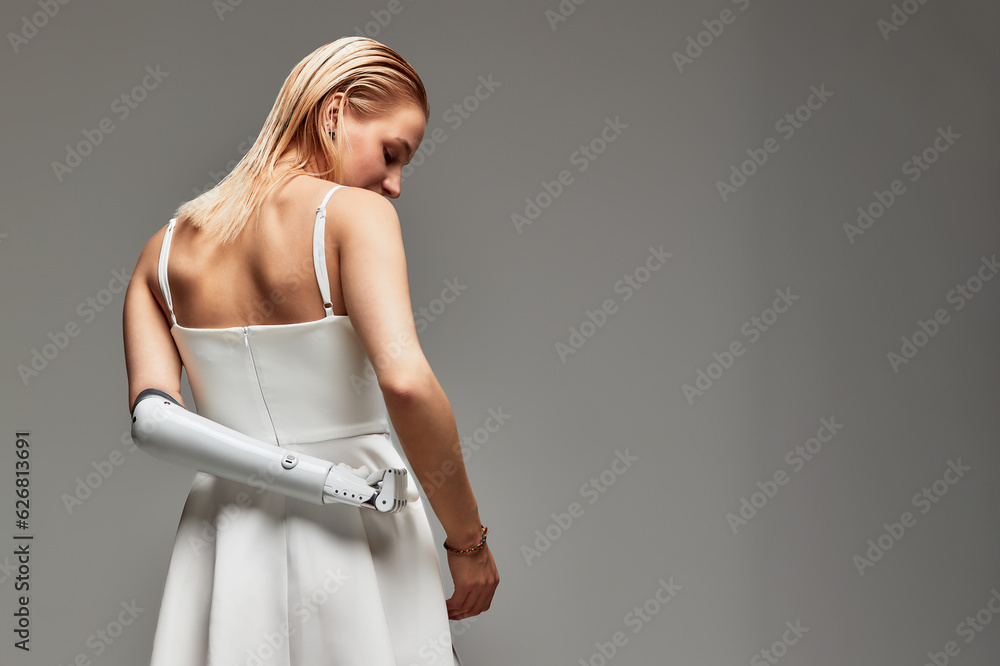 Studio portrait of a young girl with disability wearing sensory bionic ...