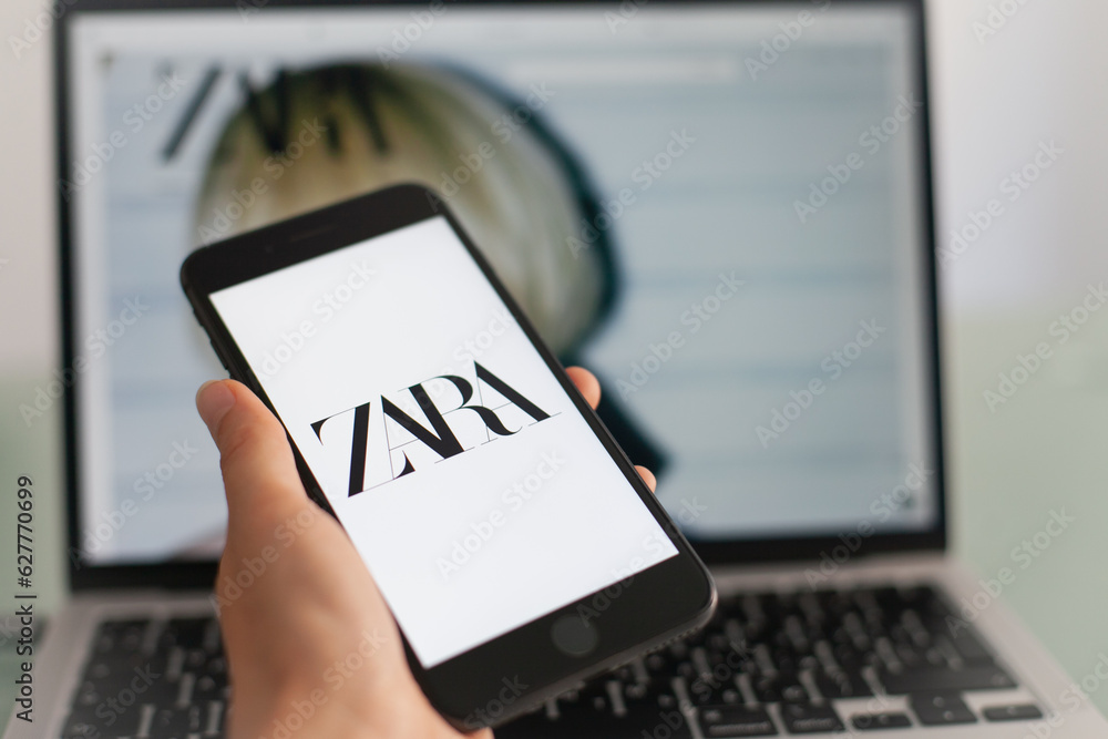 Zara logo on the screen of mobile phone. Inditex group brand identity ...
