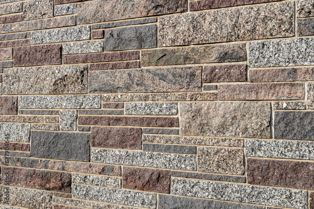Full frame texture background of a modern ashlar masonry style multi ...