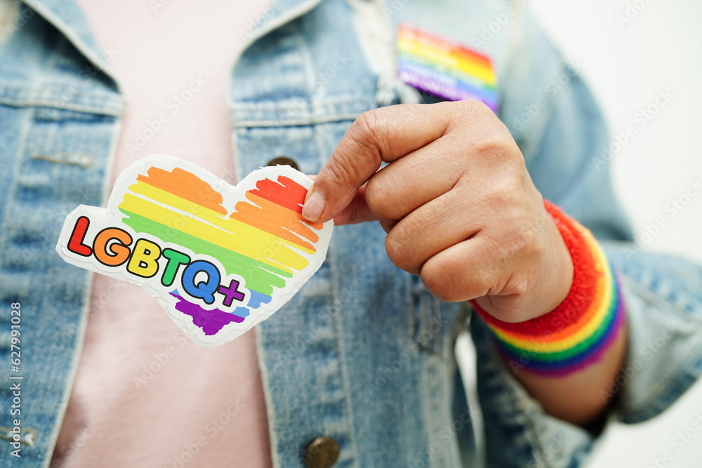 Asian woman with rainbow flag, LGBT symbol rights and gender equality ...