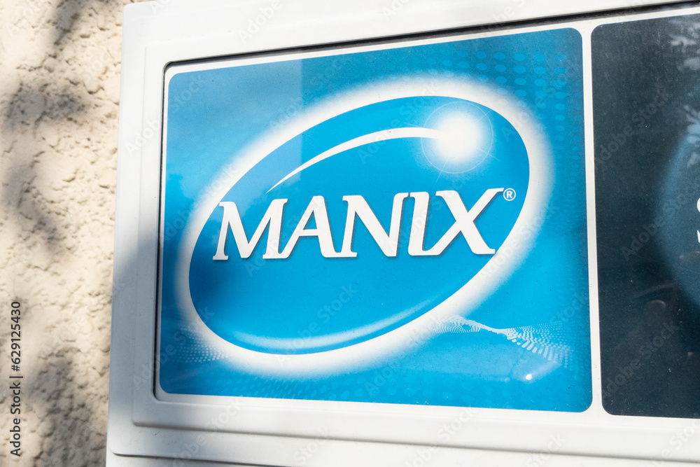 manix condoms on pharmacy street building wall facade with sign brand ...