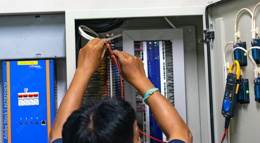 Electrician work tester measuring voltage and current of power electric ...