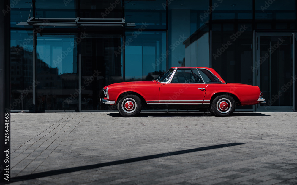 Side profile view of red classic Mercedes-Benz SL W113 Pagoda roadster ...