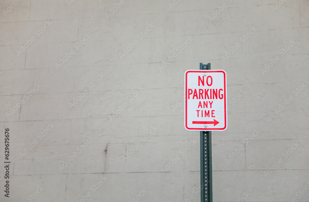 No Parking sign on a city street, representing order, restriction, and ...