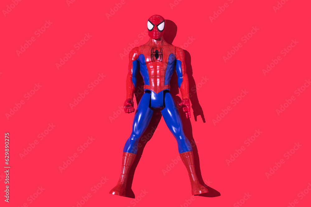 Spiderman doll from Marvel and Sony on a red background. Comic ...