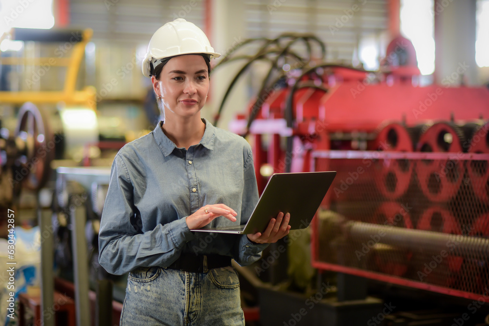 Caucasian female programmer,computer engineer wearing helmet working ...