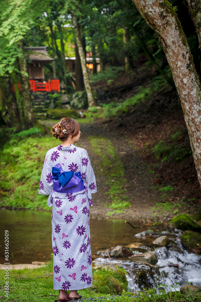 Back view of one woman wearing Japanese yukata summer kimono standing ...