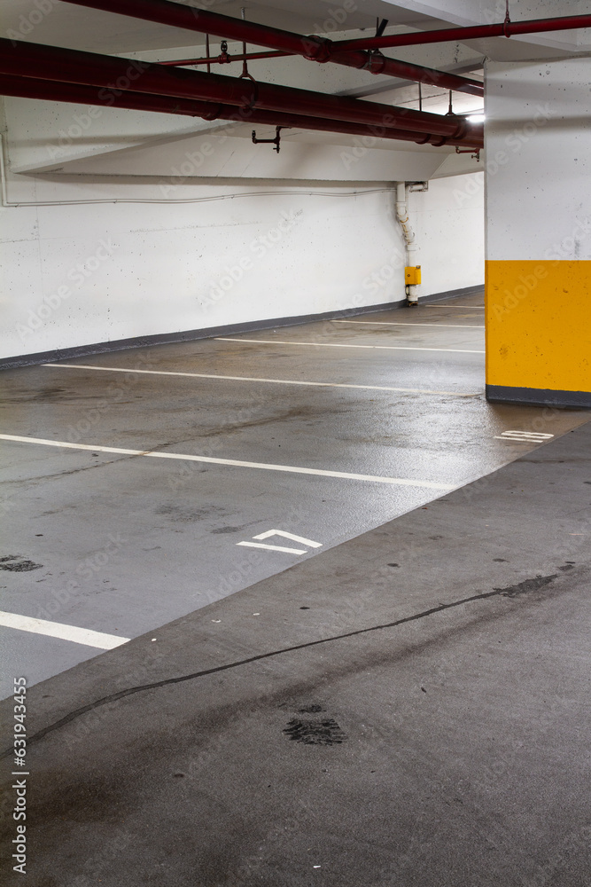 Empty underground parkade with footprint; underground car park with ...