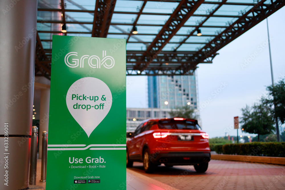 KL, MALAYSIA - 13 JUNE 2023: Grab car pick up and drop off sign at the ...
