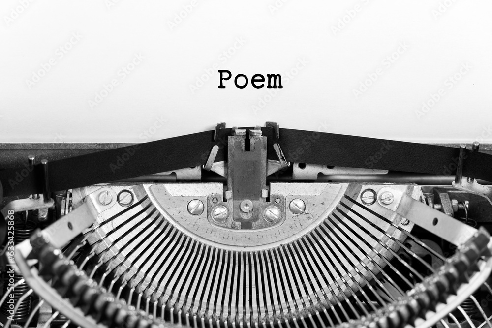 Poem word closeup being typing and centered on a sheet of paper on old ...