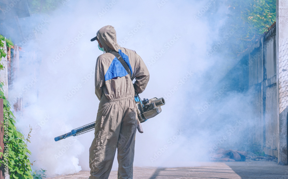Healthcare worker using fogging machine spraying chemical to eliminate ...