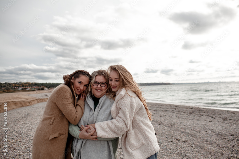 Happy multicultural friends have fun , laugh and hug each other in the ...