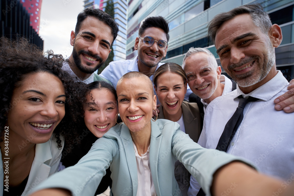Foto de Stock Selfie of happy business people taking photo with a phone. Multiracial teamwork ...