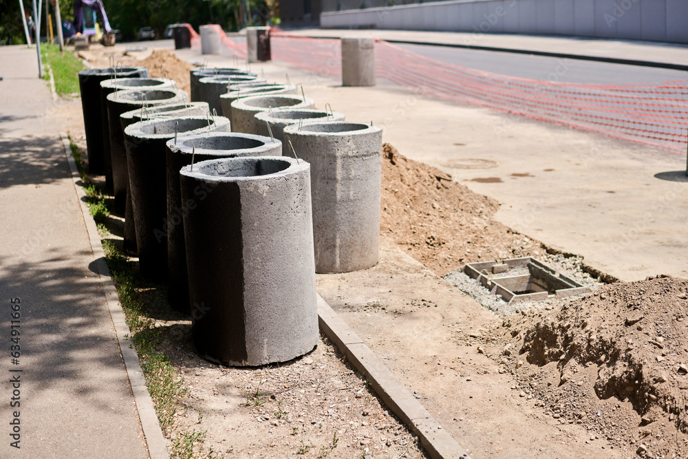 Fotografie Laying concrete manholes and drain pipes for stormwater ...