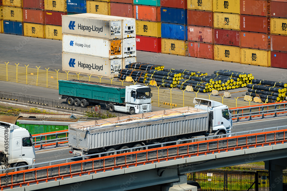 seaport, truck transports container through industrial seaport ...