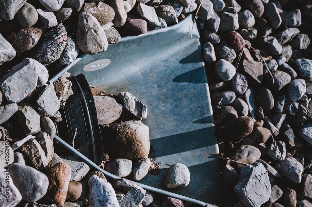 underground drainage storm drain with winged walls surrounded by rock ...