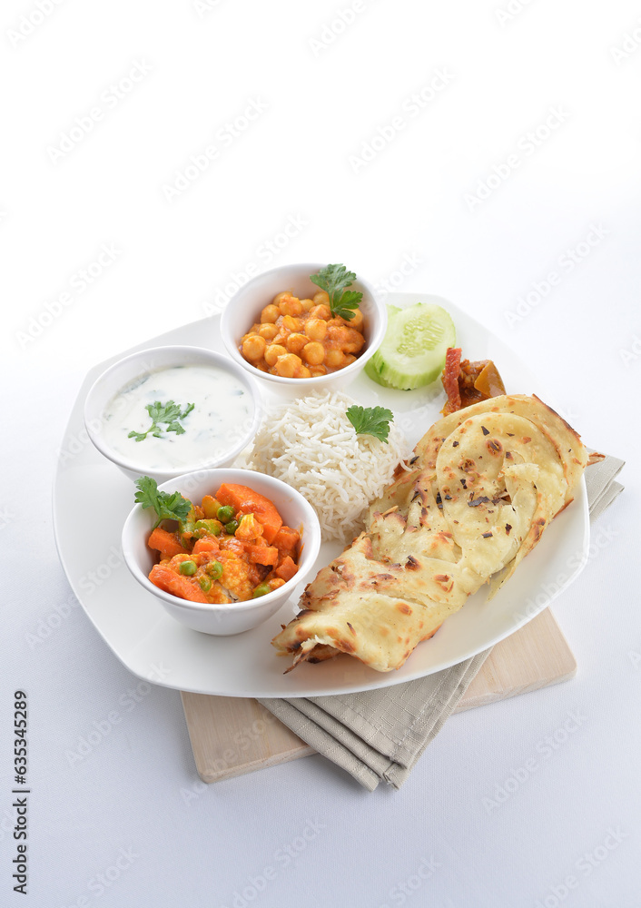 Indian traditional baked roti prata canai with curry vegetables, yogurt ...