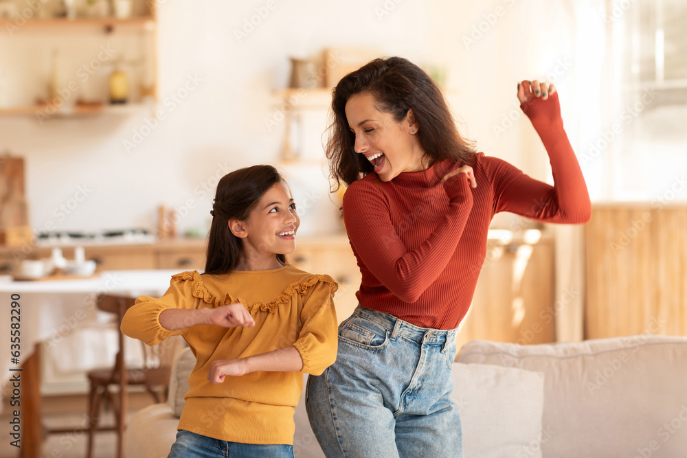 Cheerful Middle Eastern Mother And Daughter Kid Dancing At Home Stock ...