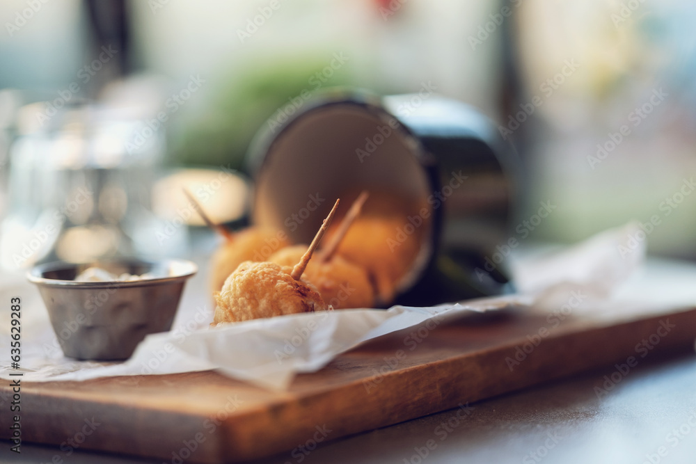 Fried cheese balls. Cheese balls in an old-fashioned mug. Serving ...