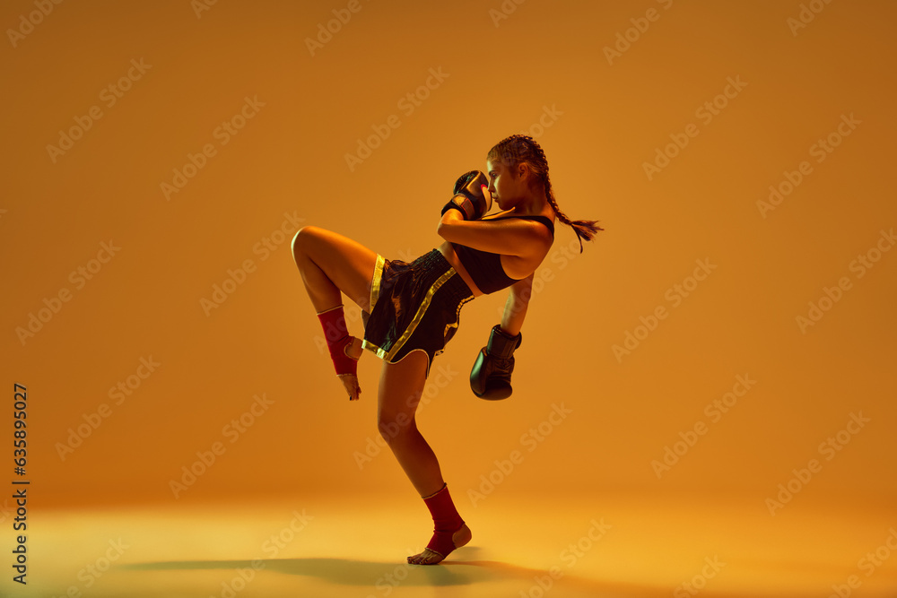 Leg kick. Sportive teen girl, mma fighter athlete in motion, training ... Leg kick. Sportive teen girl, mma fighter athlete in motion, training ...