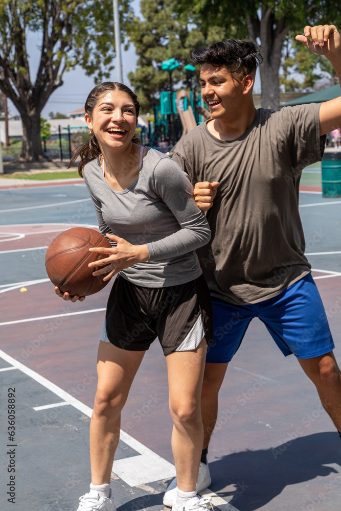 Teenagers having fun and playing basketball together Stock Photo ...