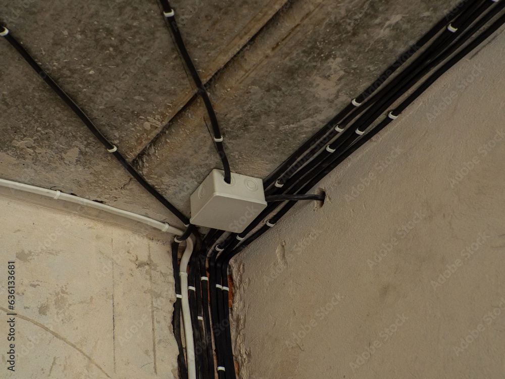 White plastic electric junction box with conduits install in house ...