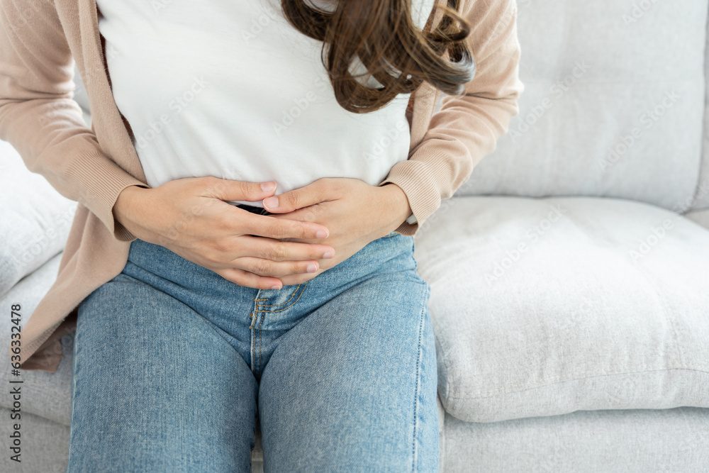 stomach ache. Asian women have abdominal pain, indigestion, gastritis, menstrual cramps ...