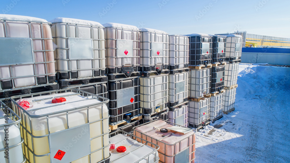 Warehouse of plastic tanks. Storage pallets with tanks on street ...