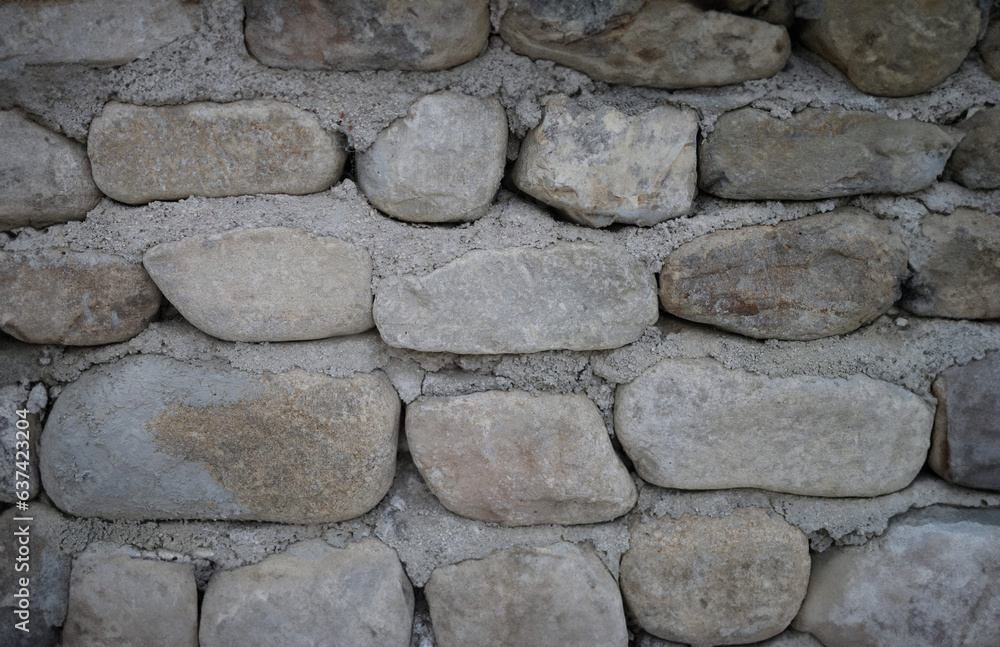 Neatly stacked rough cut stone wall seamless texture background. Old ...