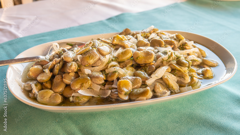 Traditional Turkish food; Fresh broad bean salad with olive oil, broad ...