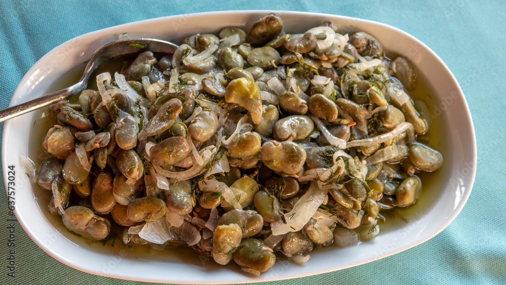 Traditional Turkish food; Fresh broad bean salad with olive oil, broad ...