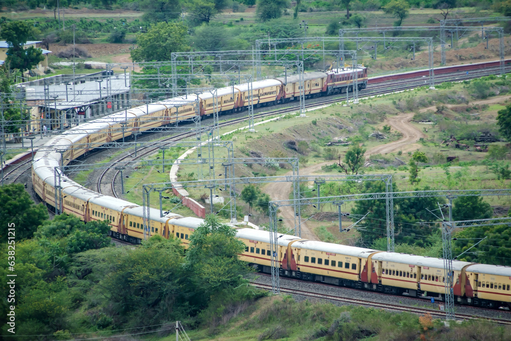 WAP4 Electric Locomotive hauls a passenger train at Shindawane near ...