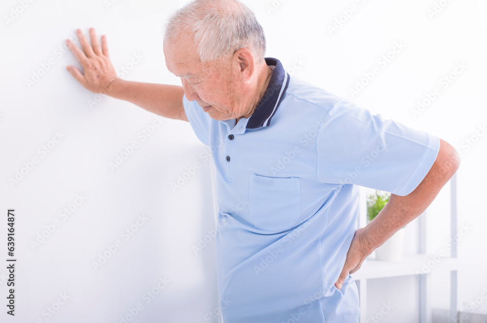 Senior man with back pain, Mature man suffering from low back pain ...