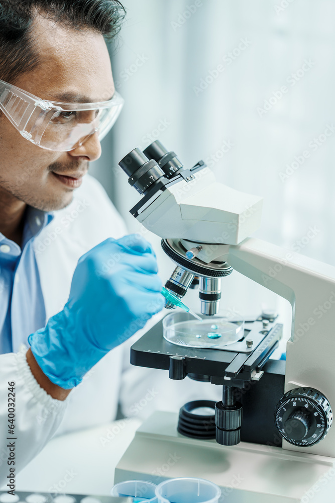 Foto de Stock Asian male scientists white coat conducting research ...