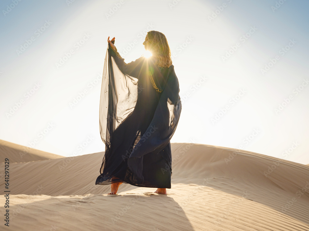 Desert adventure. Young arabian Woman posing in traditional Emirati ...