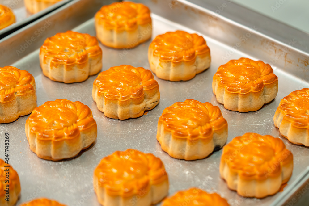 Mooncake making process. A mooncake is a Chinese bakery product ...