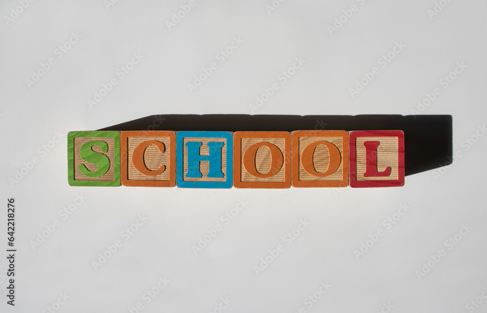 Children's colourful wooden alphabet building block letters that spell ...