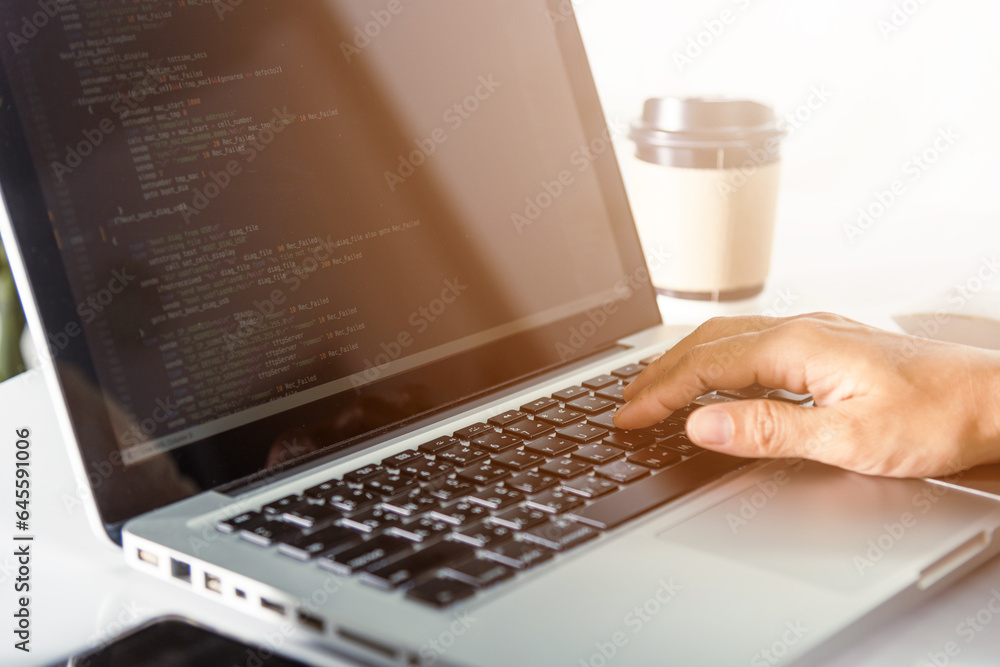 Programmer woman writing program HTML code sitting at workplace in ... Programmer woman writing program HTML code sitting at workplace in ...