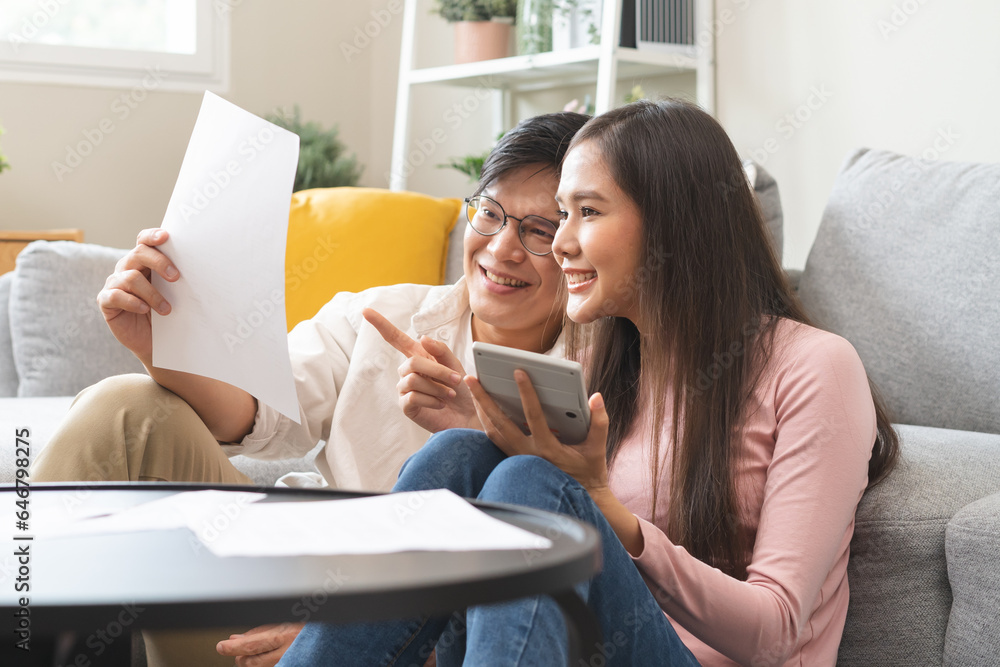 financial in family concept, Happy Asian husband and wife calculating ...