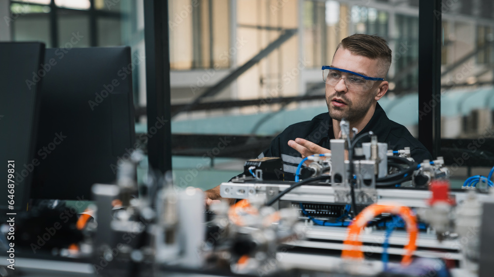 Student engineer Assembling Robotic Arm with computer in Technology ...